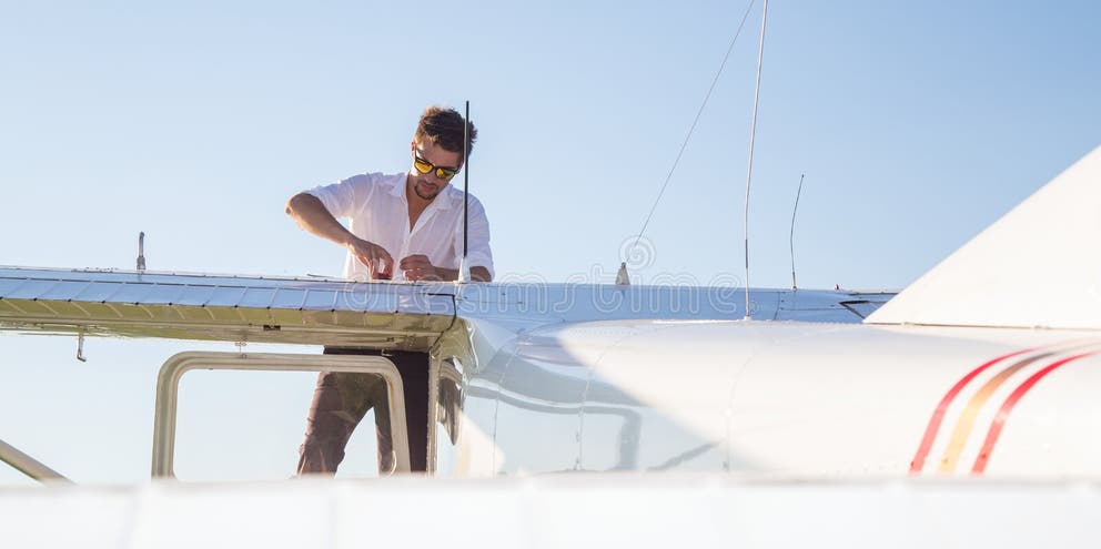 Pilot with Airplane Checking Fuel Level Stock Image - Image of outdoor ...