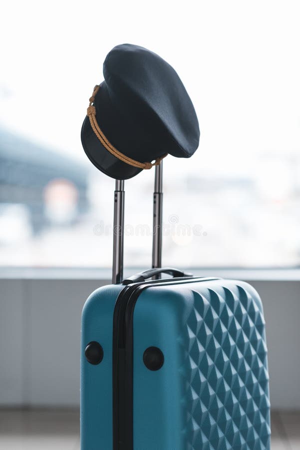 Pilot Cap Hanging on Handle of Suitcase Stock Image - Image of work ...