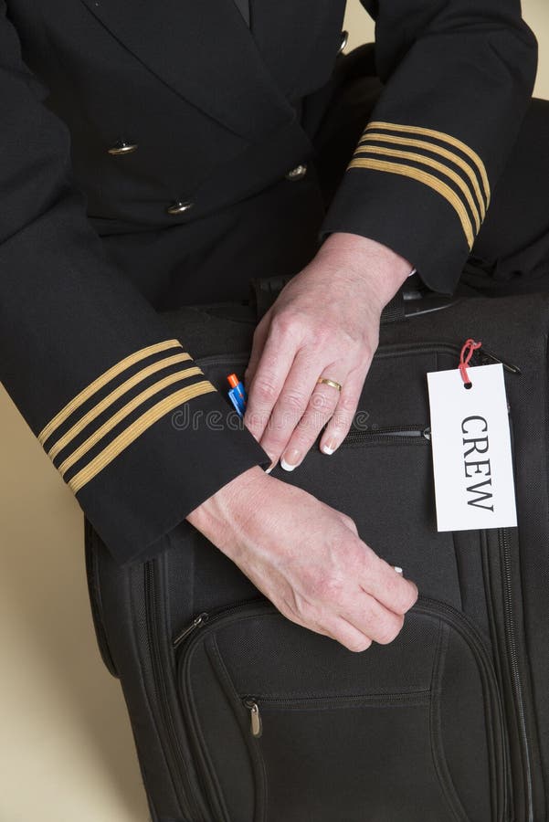 Pilot with carry on bag stock photo. Image of hands, member - 51481656