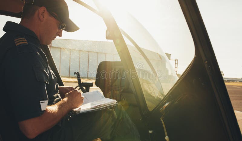 Pilot Checking the Flight Manual before a Take Off Stock Photo - Image ...