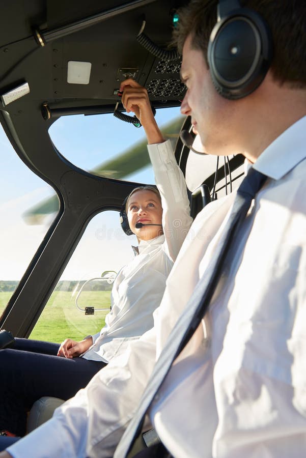 Pilot and Co Pilot in Cockpit of Helicopter Stock Photo - Image of ...