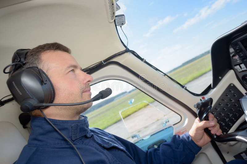 Pilot in cockpit aircraft stock photo. Image of windscreen - 87667790