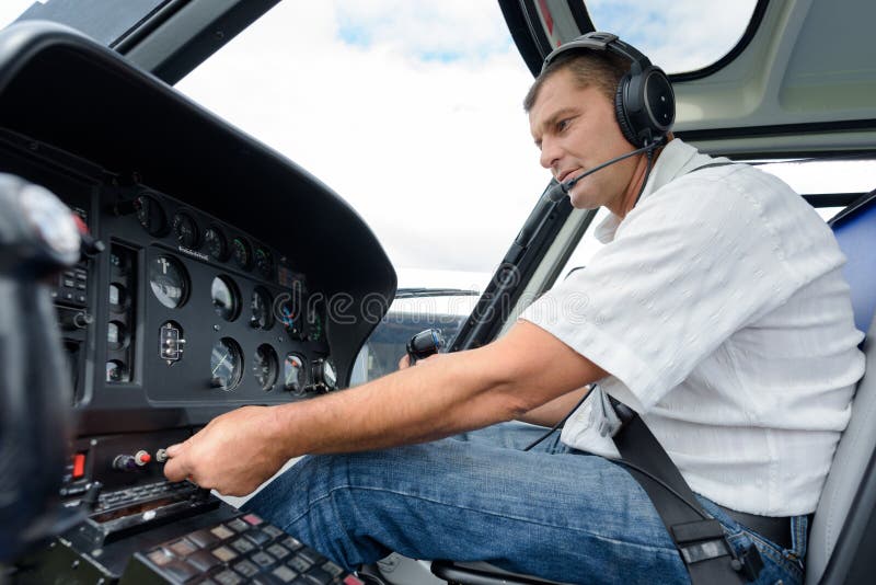 Pilot in Cockpit Helicopter during Flight Stock Photo - Image of person ...