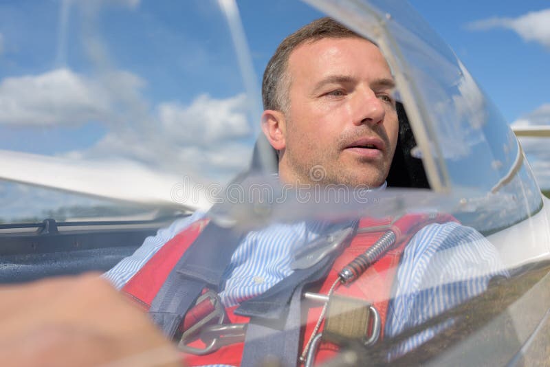 Pilot inside cockpit plane stock photo. Image of hangar - 103746848