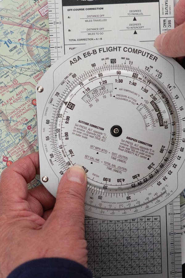 Pilot Plots a Flight on a Sectional Map for a Vector from One Airport ...