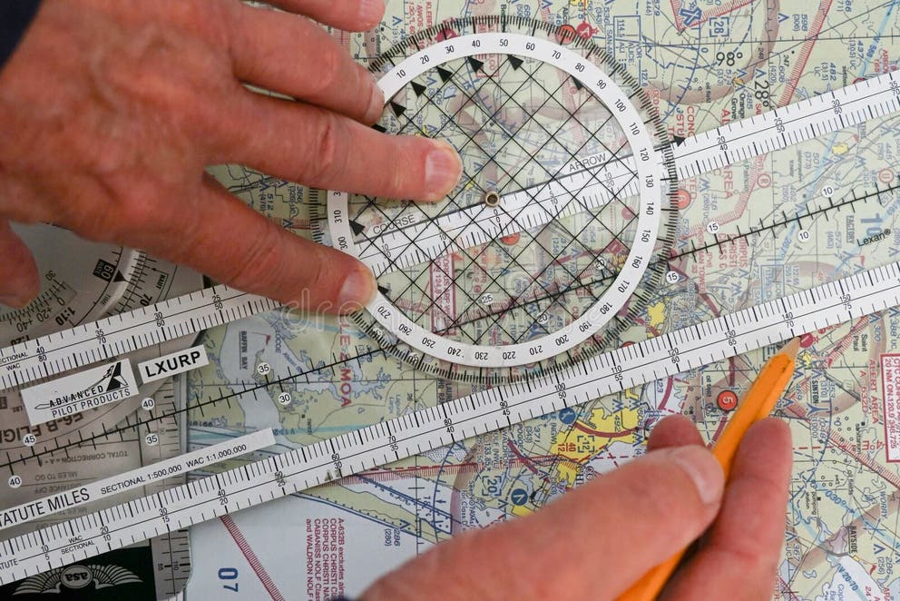 Pilot Plots a Flight on a Sectional Map for a Vector from One Airport ...