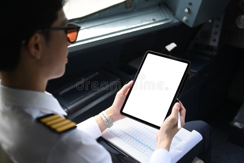 Pilot Preparing Flight Path and Check List from Digital Tablet in the ...