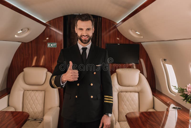 Pilot of Private Jet Showing Thumb Up while Smiling at Camera Stock ...