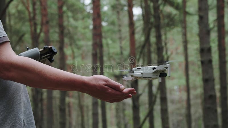 The Pilot with the Remote Control in His Hands Launches the Drone. the ...