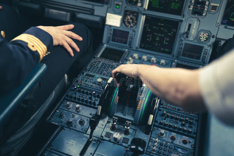 Pilot`s Hand Accelerating on the Throttle in a Commercial Airliner ...