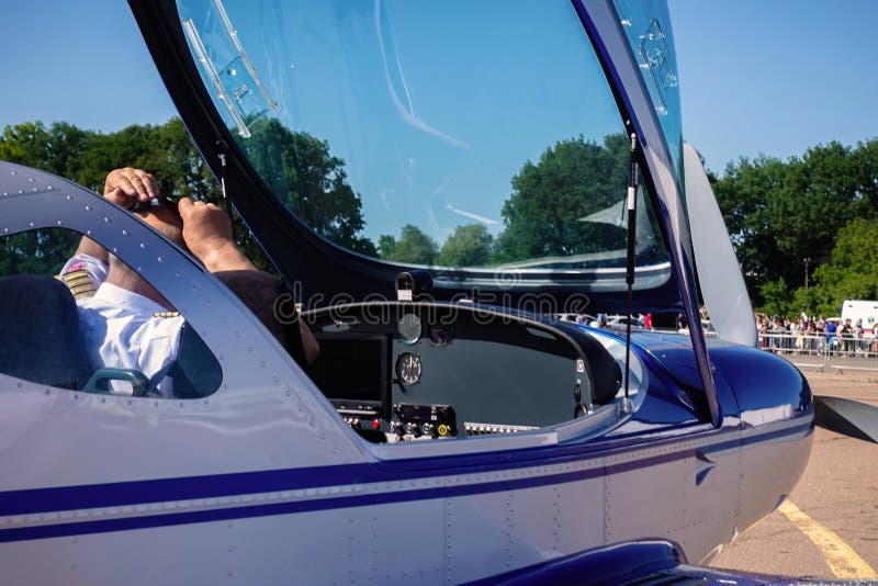 The Pilot Sits in the Open Cockpit of a Light Aircraft Stock Photo ...