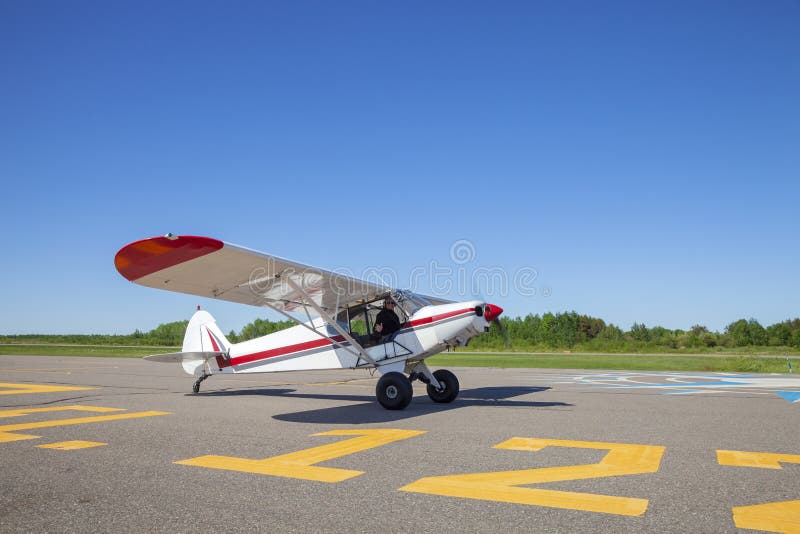 Pilot in Small Plane Taxis Toward Runway for Take Off Stock Photo ...