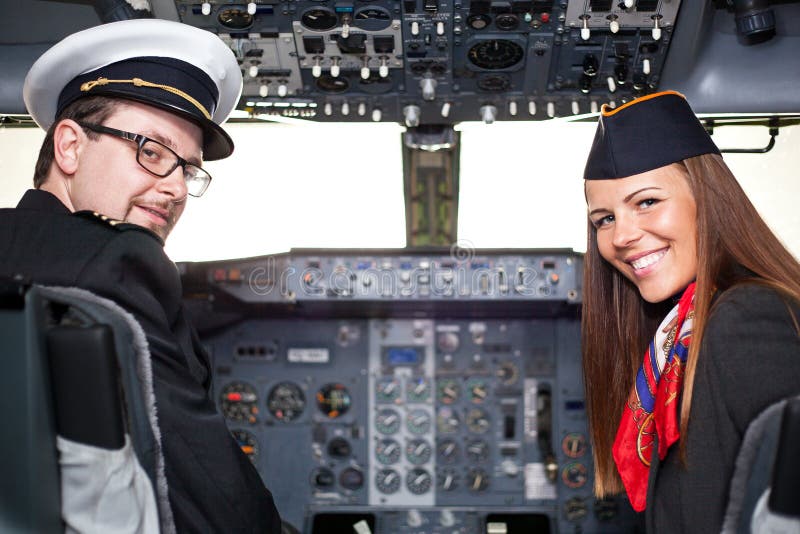 Pilot and Stewardess Sitting in an Airplane Cabin Stock Image - Image ...