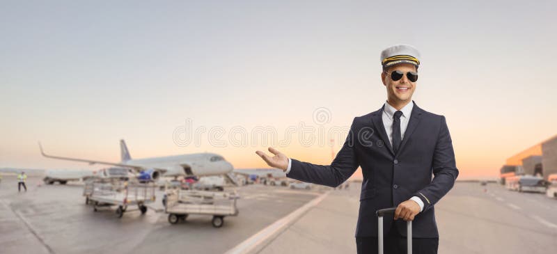 Pilot with a Suitcase on an Airport with Plane in the Background and ...