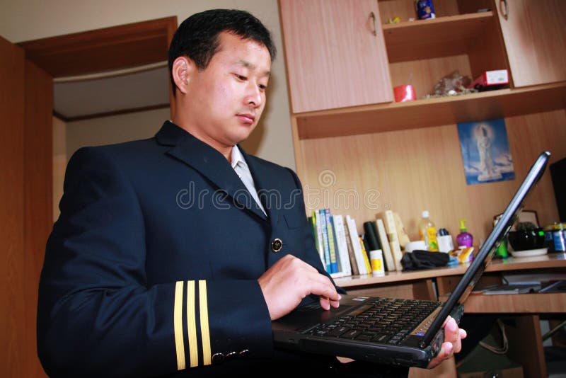 Pilot using a laptop stock photo. Image of pilot, notebook - 6605696