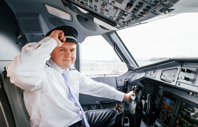 Pilot on the Work in the Passenger Airplane. Preparing for Takeoff ...
