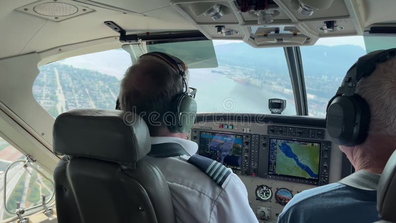 Pilots Navigating Small Aircraft Cockpit in Flight, Digital Instruments ...