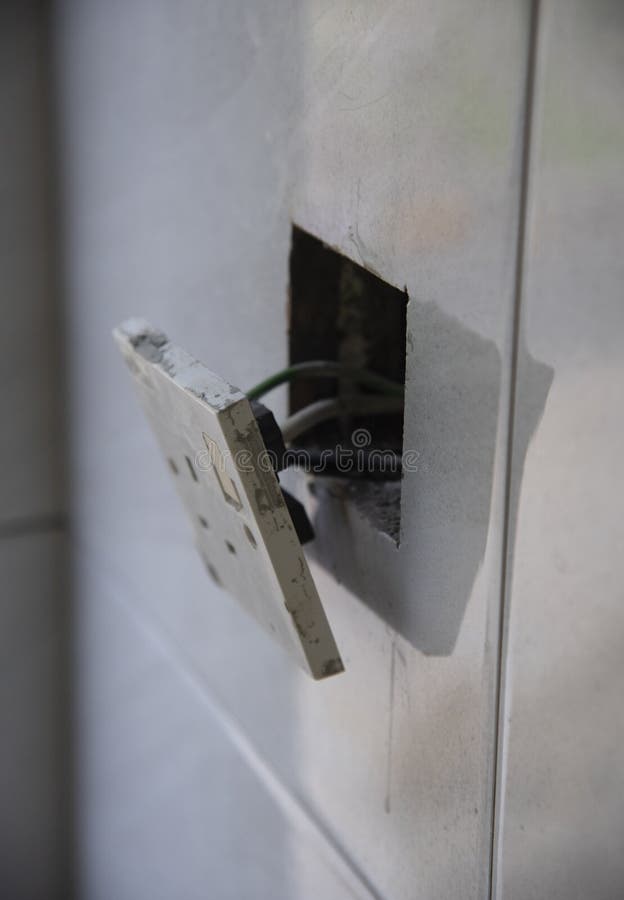 3-pin Plug Socket Adapter Hanging Out from the Wall Stock Image - Image ...