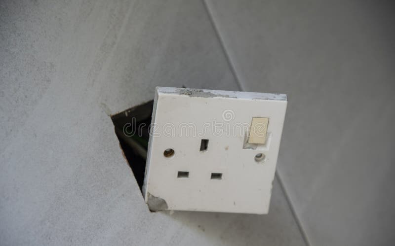 3-pin Plug Socket Adapter Hanging Out from the Wall Stock Image - Image ...