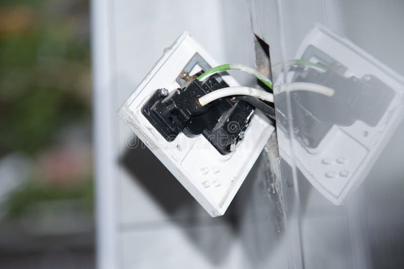 3-pin Plug Socket Adapter Hanging Out from the Wall Stock Image - Image ...