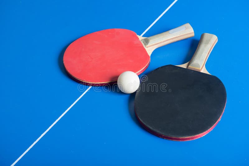 Pin Pong Ball and Red Paddle on Blue Board Stock Photo - Image of ...