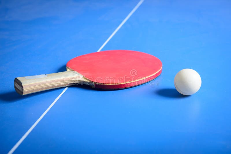 Pin Pong Ball and Red Paddle on Blue Board Stock Photo - Image of ...