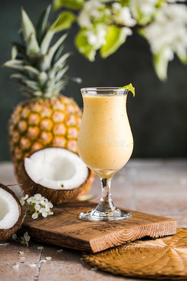 Pina Colada Pineapple Cocktail or Lassi on a Rustic Wooden Table Stock ...