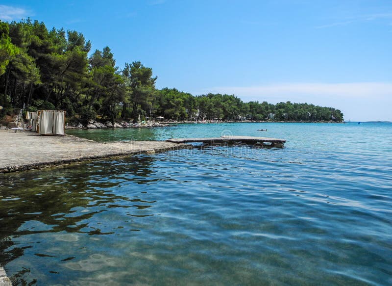 Pine beach in Pakostane stock image. Image of boulders - 137403795