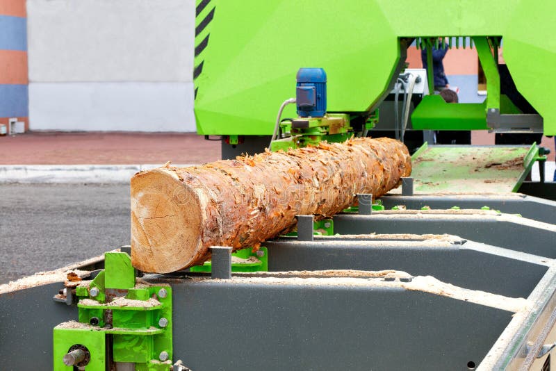 A Large Pine Log is Mounted on a Modern Woodworking Machine Stock Image ...