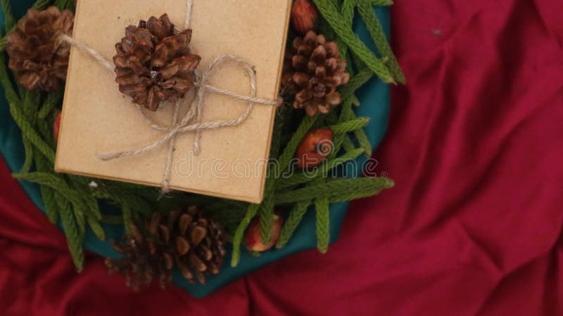 Pine Leaves, Dried Pine, and Gift Box with Red Background. Concept of Christmas Stock Image ...