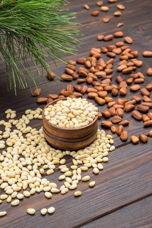Pine Nut Kernels in Wooden Box and on Table. Inshell Pine Nuts Stock ...