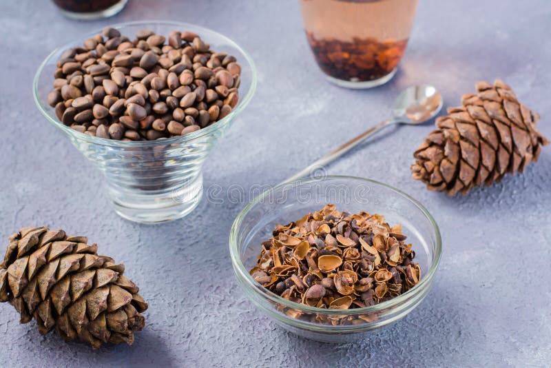 Pine Nut Shells in a Bowl Ready for Decoction and Pine Nuts on the ...