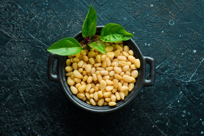 Pine Nuts in a Black Stone Bowl. Stock Photo - Image of cone, nuts ...