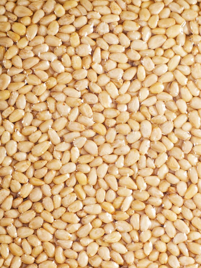 Pine Nuts Close-up in Full Screen. Surface Made of Peeled Pine Nut ...