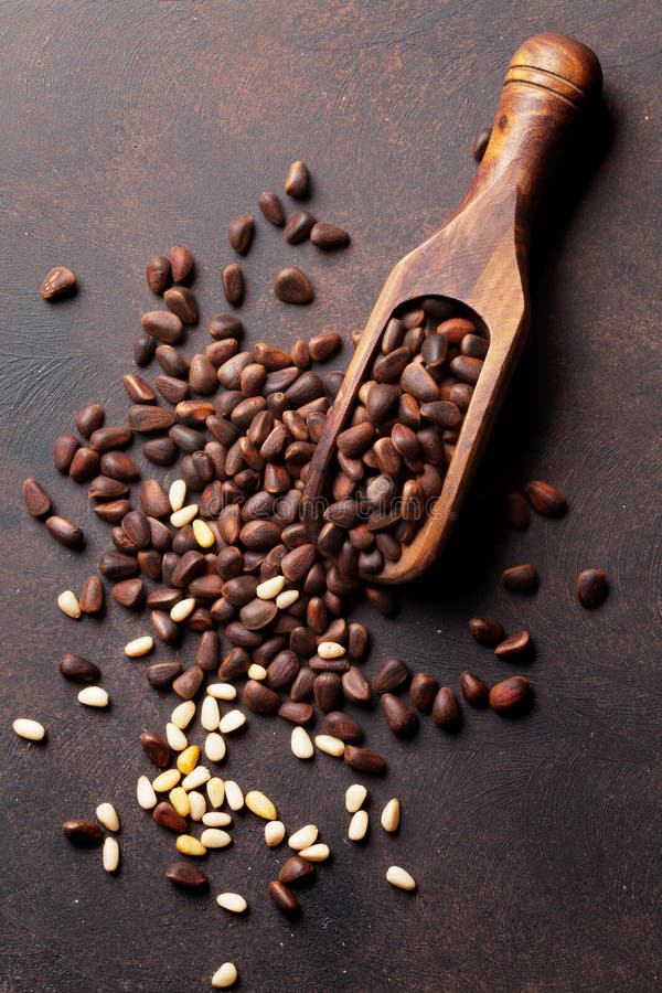Pine nuts on stone table stock photo. Image of almond - 86668922