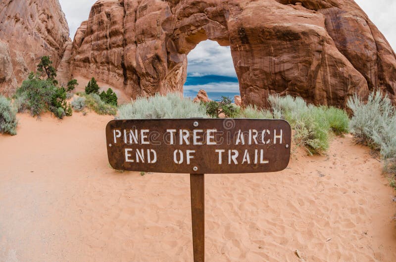 Pine Tree Arch End of Trail Sign Stock Photo - Image of sand, rock ...