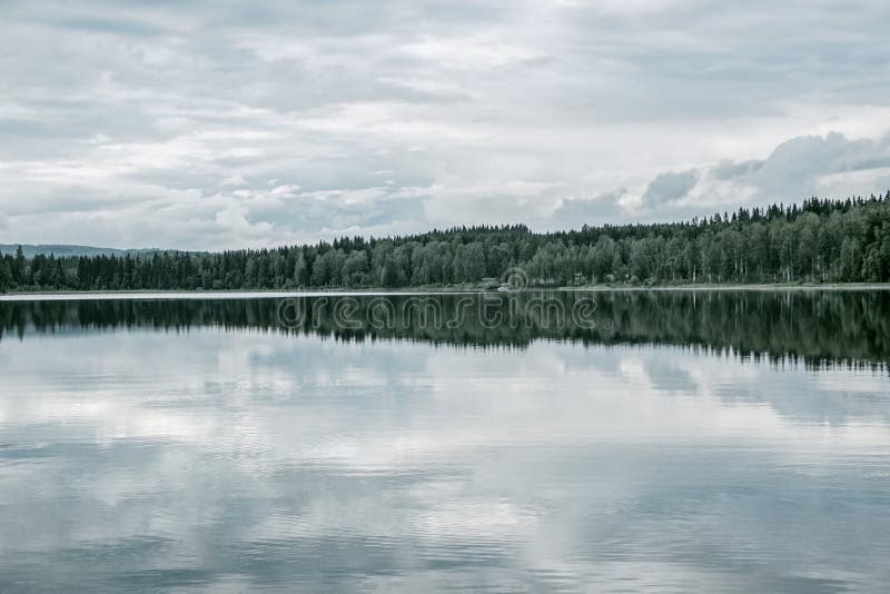 Tree Reflection in Peaceful Lake Stock Image - Image of lake, mountains ...