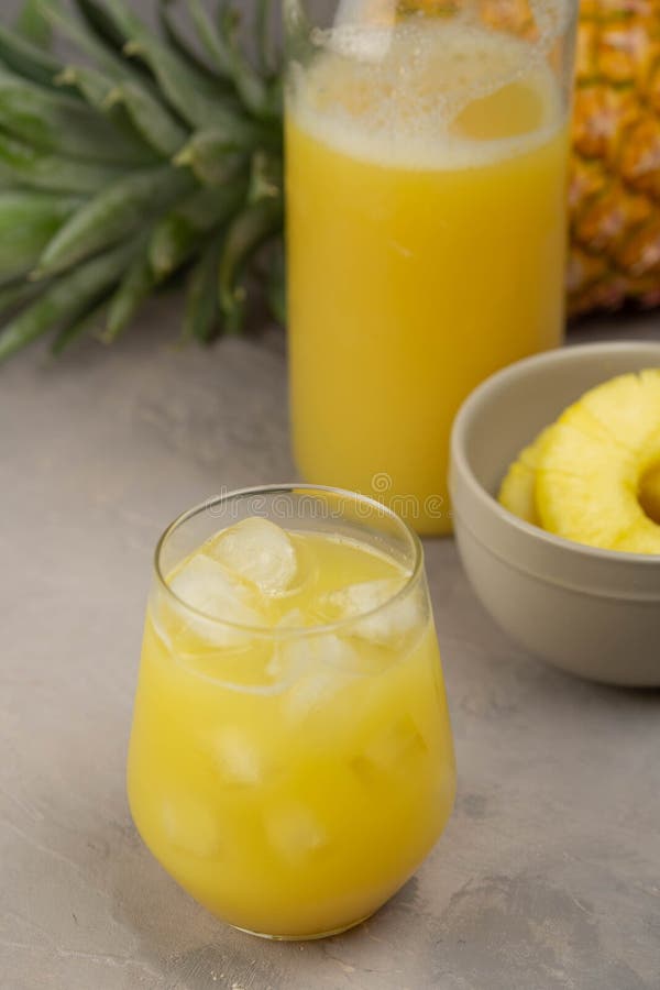 Pineapple Juice in a Clear Glass and Bottle on a Light Table. Pineapple ...