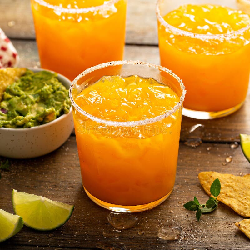 Pineapple and Mango Margarita with Chips and Guacamole Stock Image ...