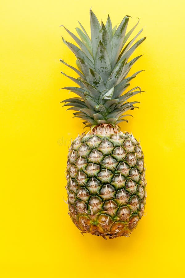 Pineapple on Solid Yellow Background Stock Photo - Image of natural ...