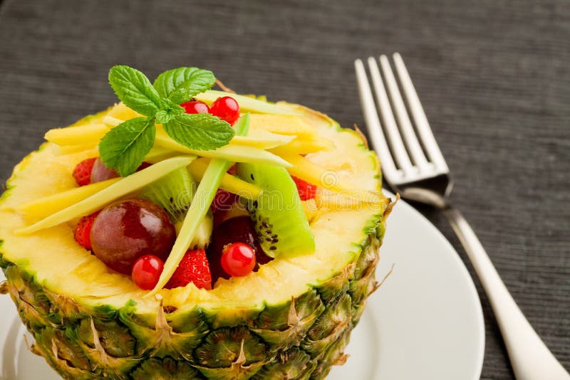 Pineapple Stuffed with Fruits Stock Photo - Image of mint, desserts ...