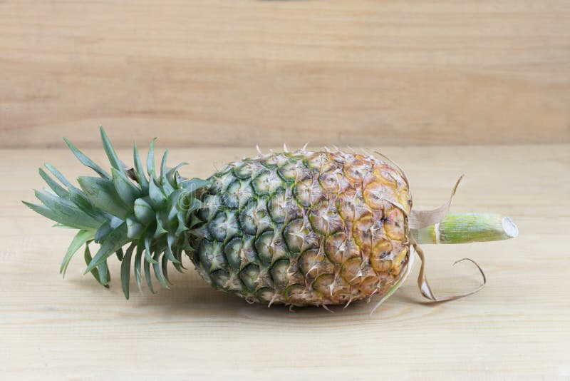 Pineapple on Wooden of Brown Stock Image - Image of fresh, wood: 91882541