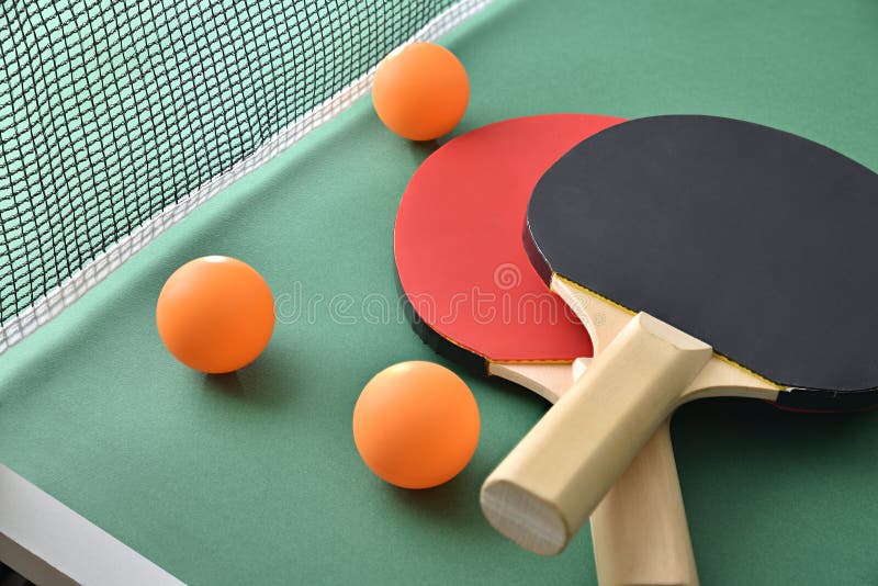 Ping Pong Paddles and Balls on Green Game Table Stock Photo - Image of ...
