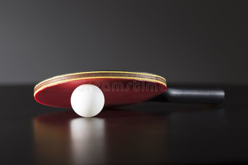 Ping Pong Racket and Ball on Dark Table Stock Image - Image of ball ...