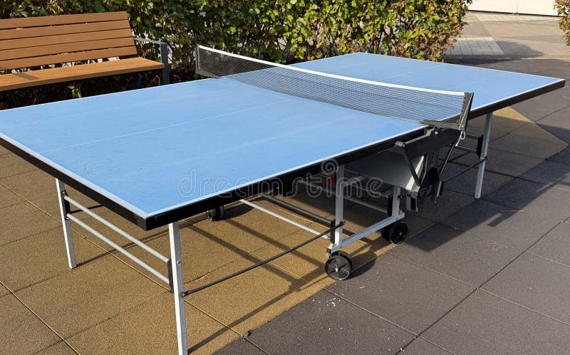 Ping-pong table with a net stock image. Image of leisure - 346471405