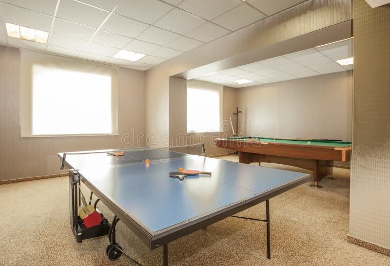 Ping Pong Table Ready for Play Inside with Balls and Rackets in ...