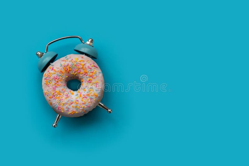 Pink Alarm Clock Donut on Blue Background. Breakfast Time or Minimal ...