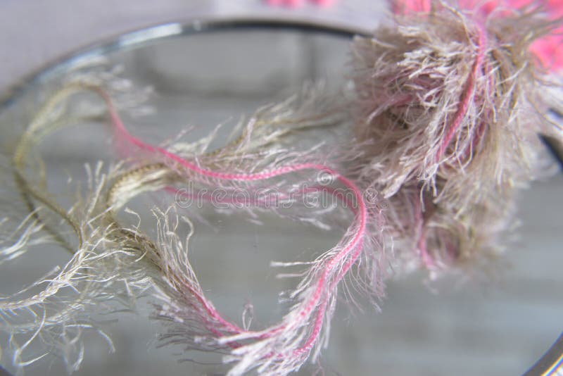 Pink Ball of Thread Unwound on a Gray Blur Background Stock Photo ...