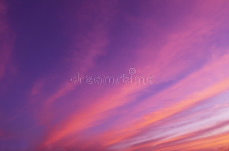 Pink Beam Bursting from the Clouds in the Golden Sky at Sunset Stock ...