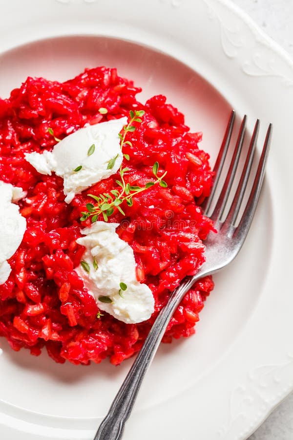 Pink Beetroot Risotto with Feta Cheese in White Plate Stock Photo ...